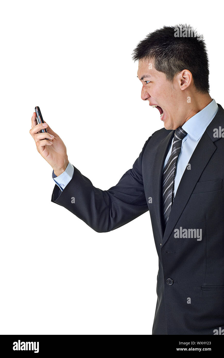 Angry businessman yelling to cellphone on white background Stock Photo ...