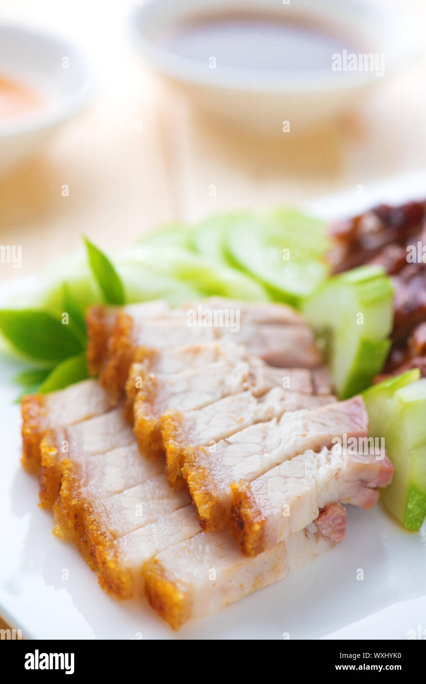 Siu Yuk or crispy roasted belly pork Chinese style and roast duck ...