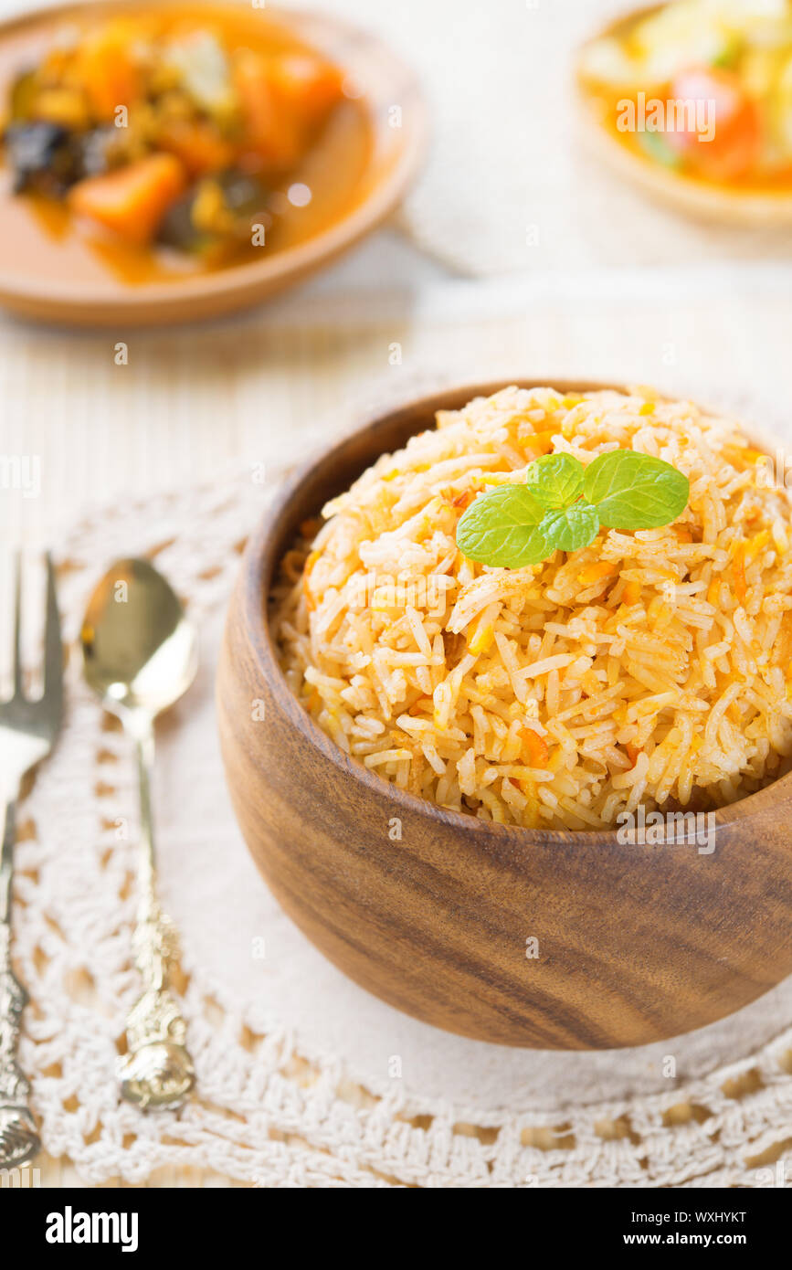 Indian vegetarian food. Biryani rice and curry dhal on dining table ...