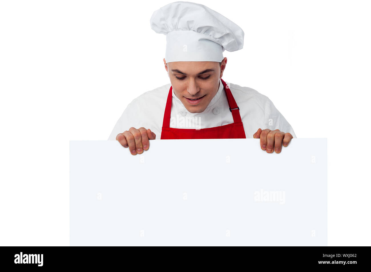 Handsome male chef behind blank ad board Stock Photo - Alamy