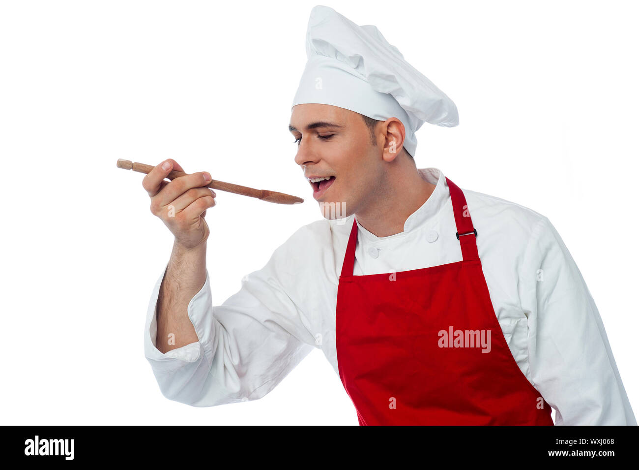 Chef man tasting food Cut Out Stock Images & Pictures - Alamy