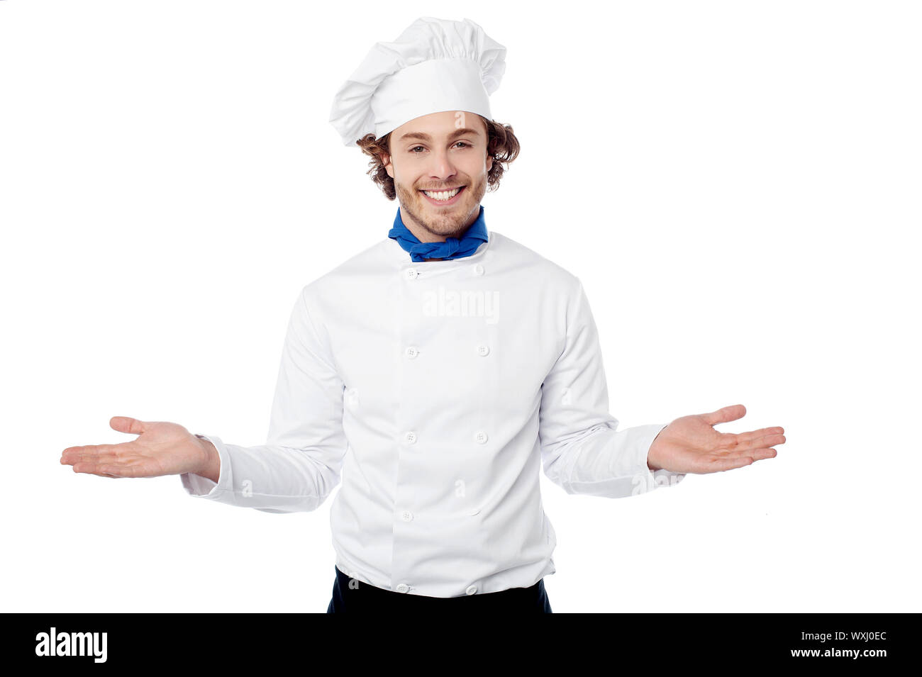 Male chef in uniform welcoming guests Stock Photo - Alamy