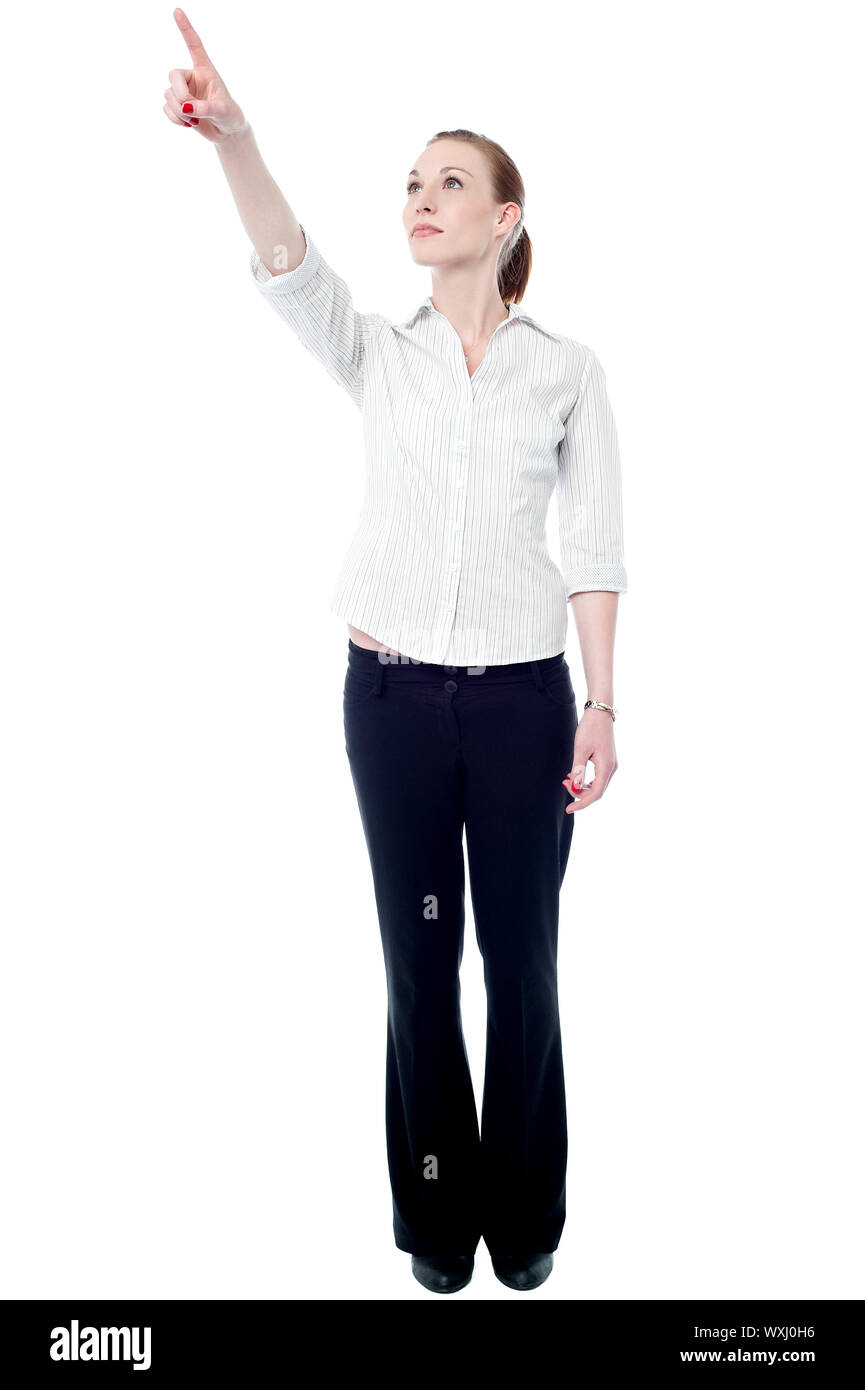 Pretty corporate lady pointing at something Stock Photo - Alamy