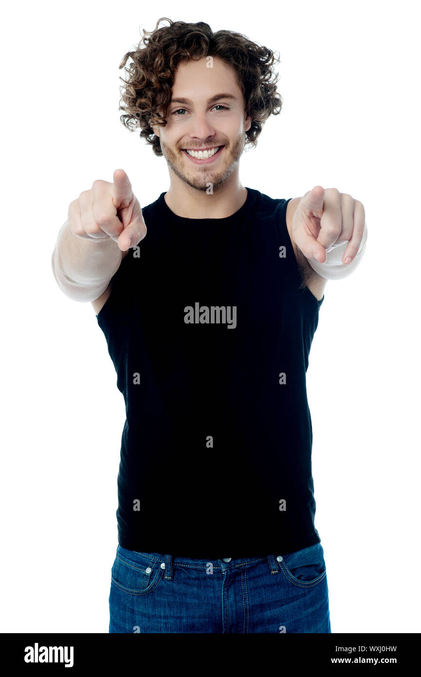 Cheerful young man pointing towards camera Stock Photo - Alamy Cheerful young man pointing towards camera Stock Photo - Alamy