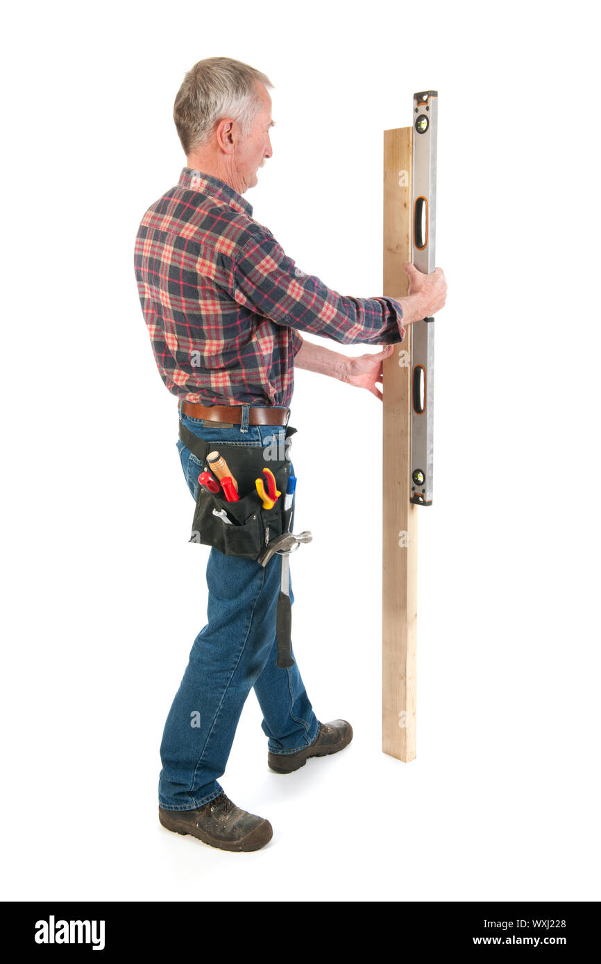 Senior man is working with plumb rule Stock Photo - Alamy