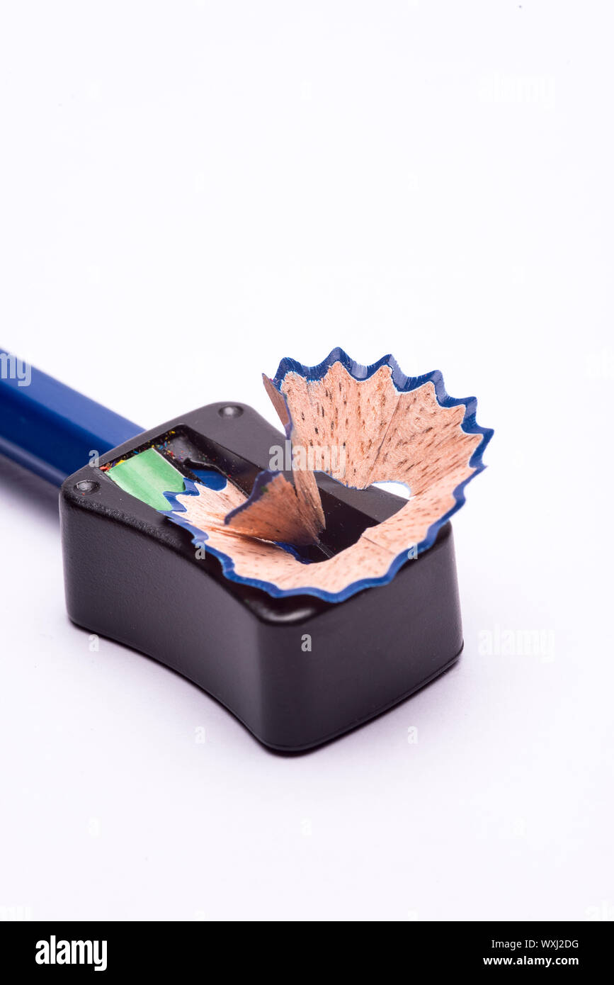 Blue coloured pencil sharpened using a sharpner Stock Photo - Alamy