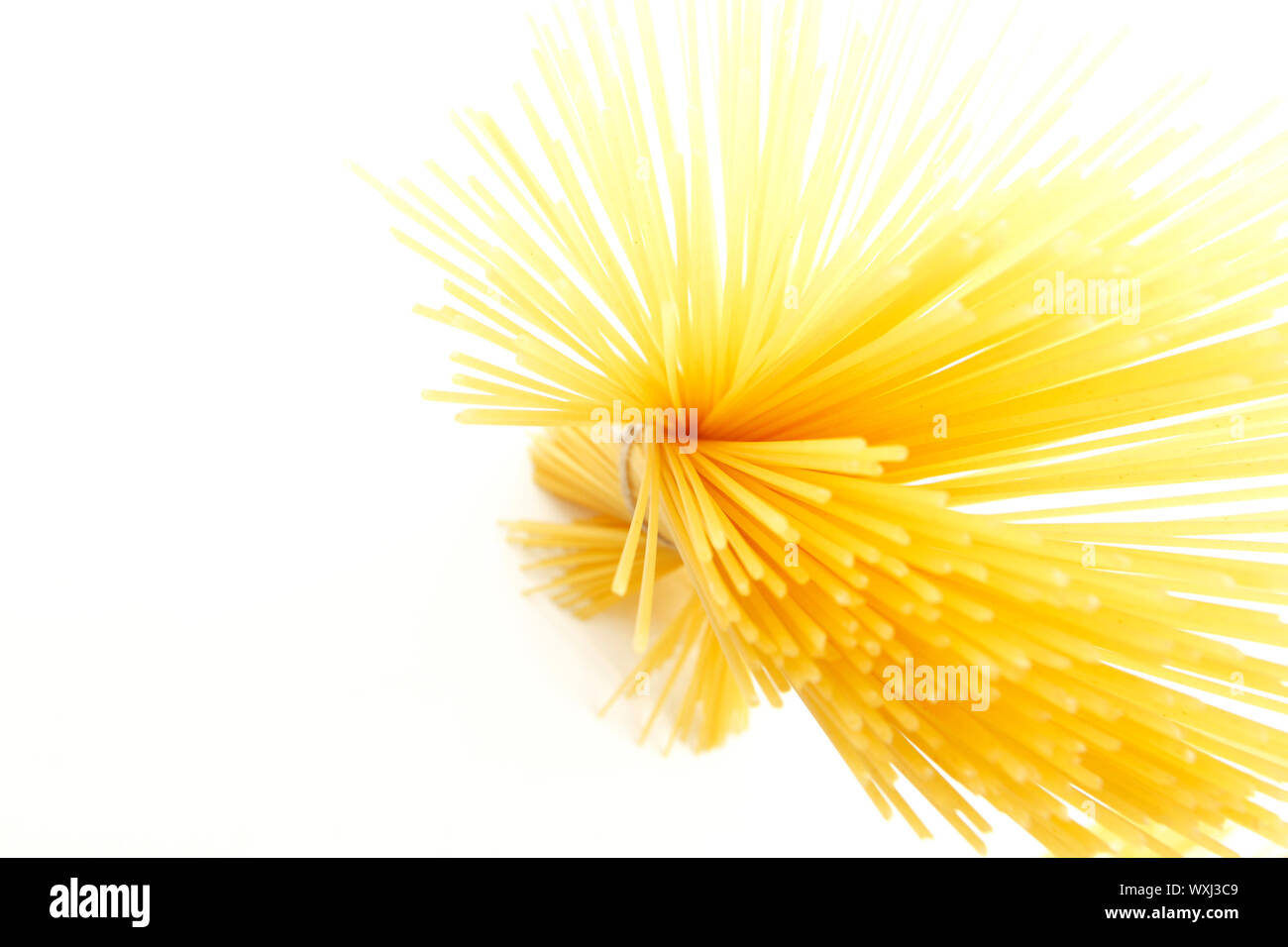 Dry spaghetti isolated on white background Stock Photo - Alamy