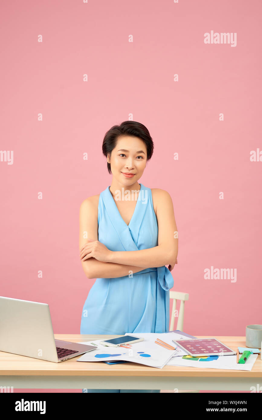 Confident Asian female freelancer at her workspace desk Stock Photo - Alamy
