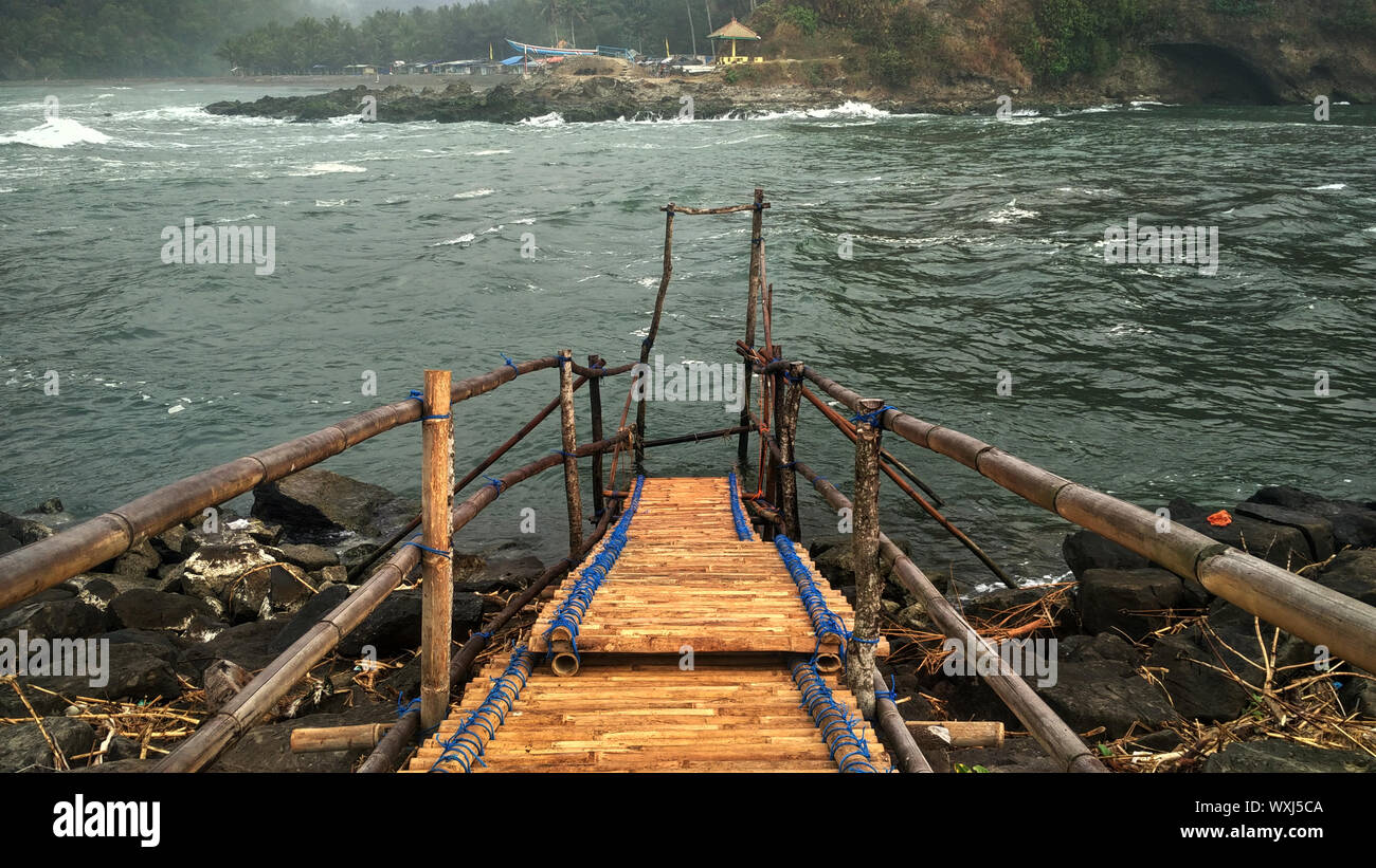 Bamboo pier by the ocean, Indonesia Stock Photo - Alamy