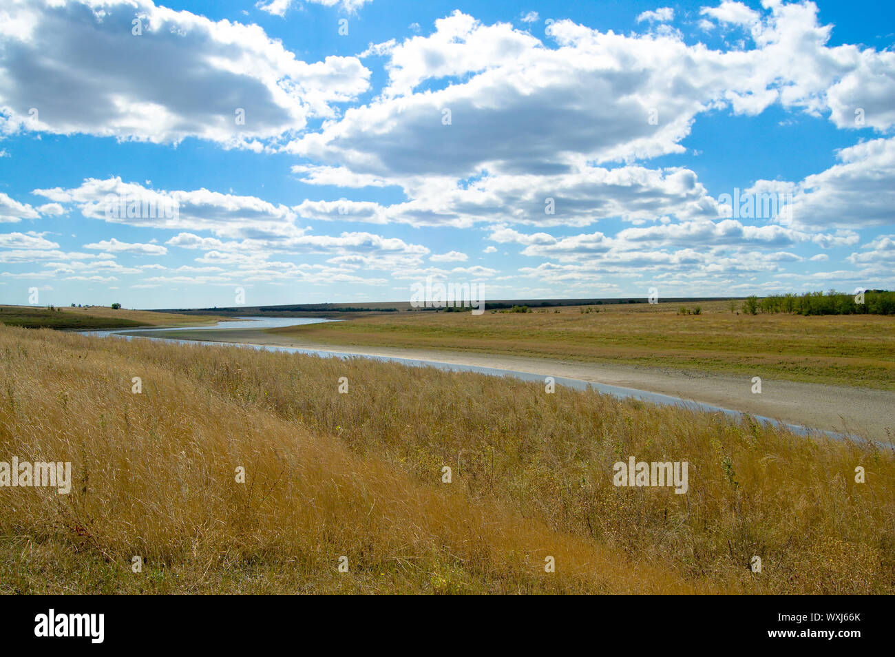 steppe river under blue sky with clouds Stock Photo - Alamy