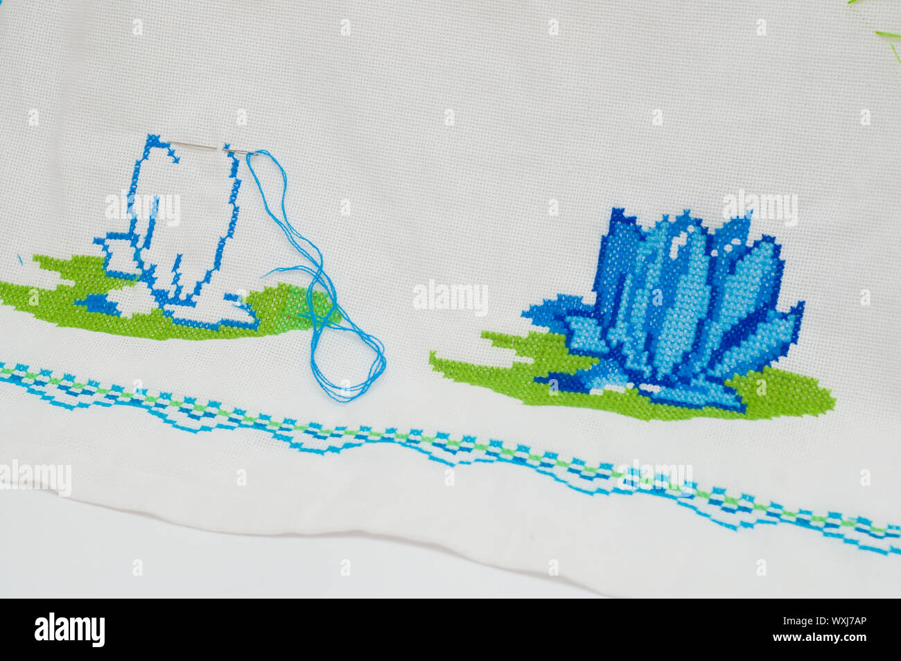 unfinished embroidery by cross stitch Stock Photo - Alamy