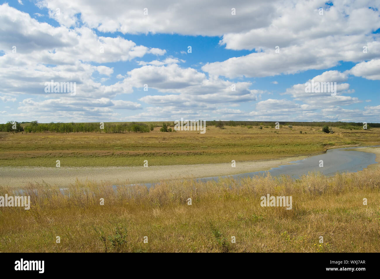 steppe river under blue sky with clouds Stock Photo - Alamy