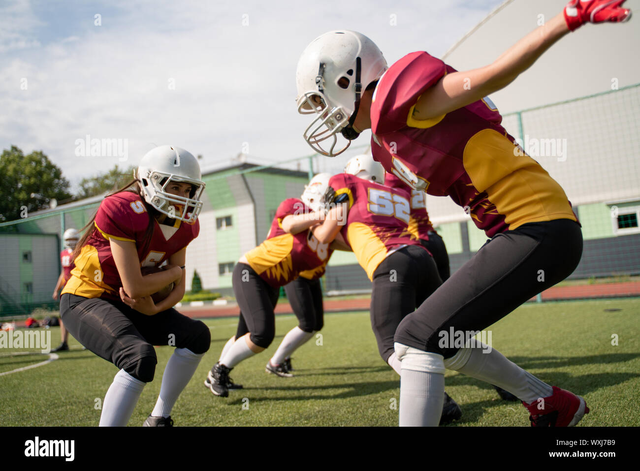 Photo of female team playing rugby on playground on summer day Stock ...