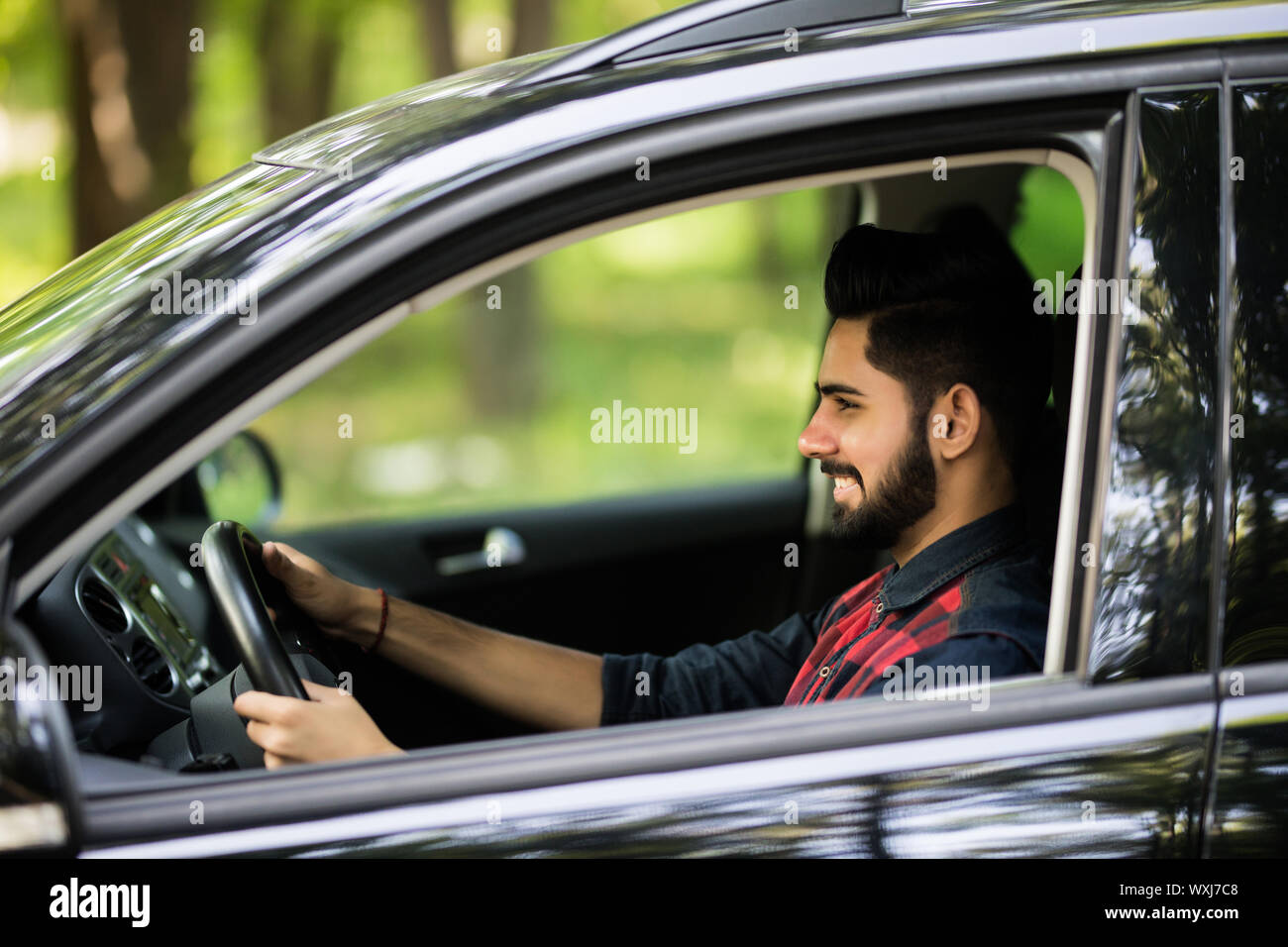 Indian boy driving a car hi-res stock photography and images - Alamy