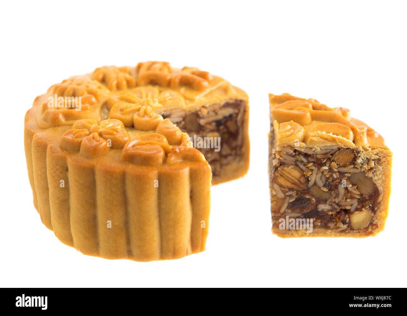 Traditional mooncake cutted isolated on white background. Chinese mid ...