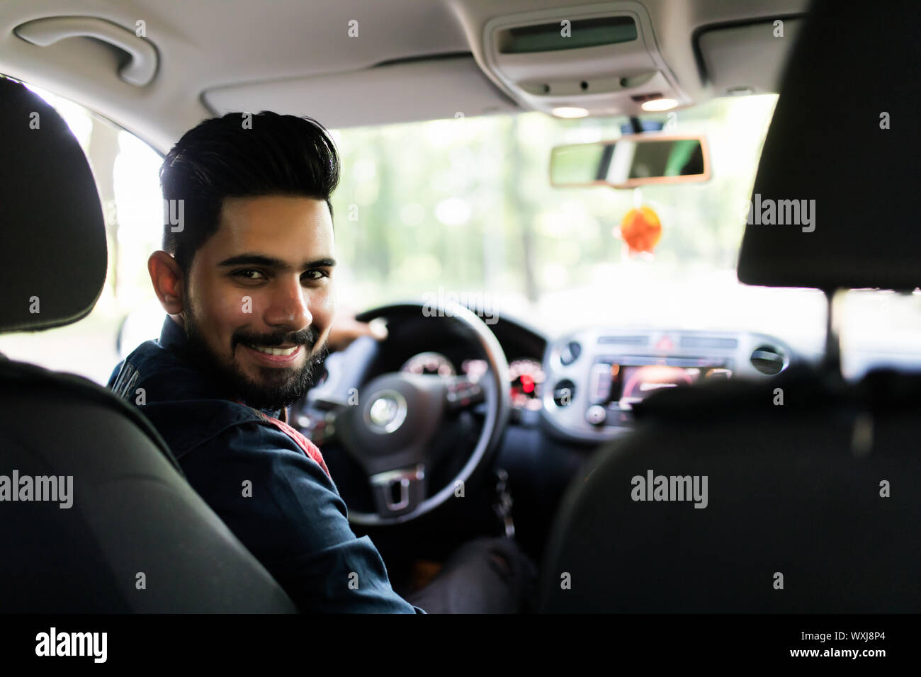 Rear view young indian businessman hi-res stock photography and images ...