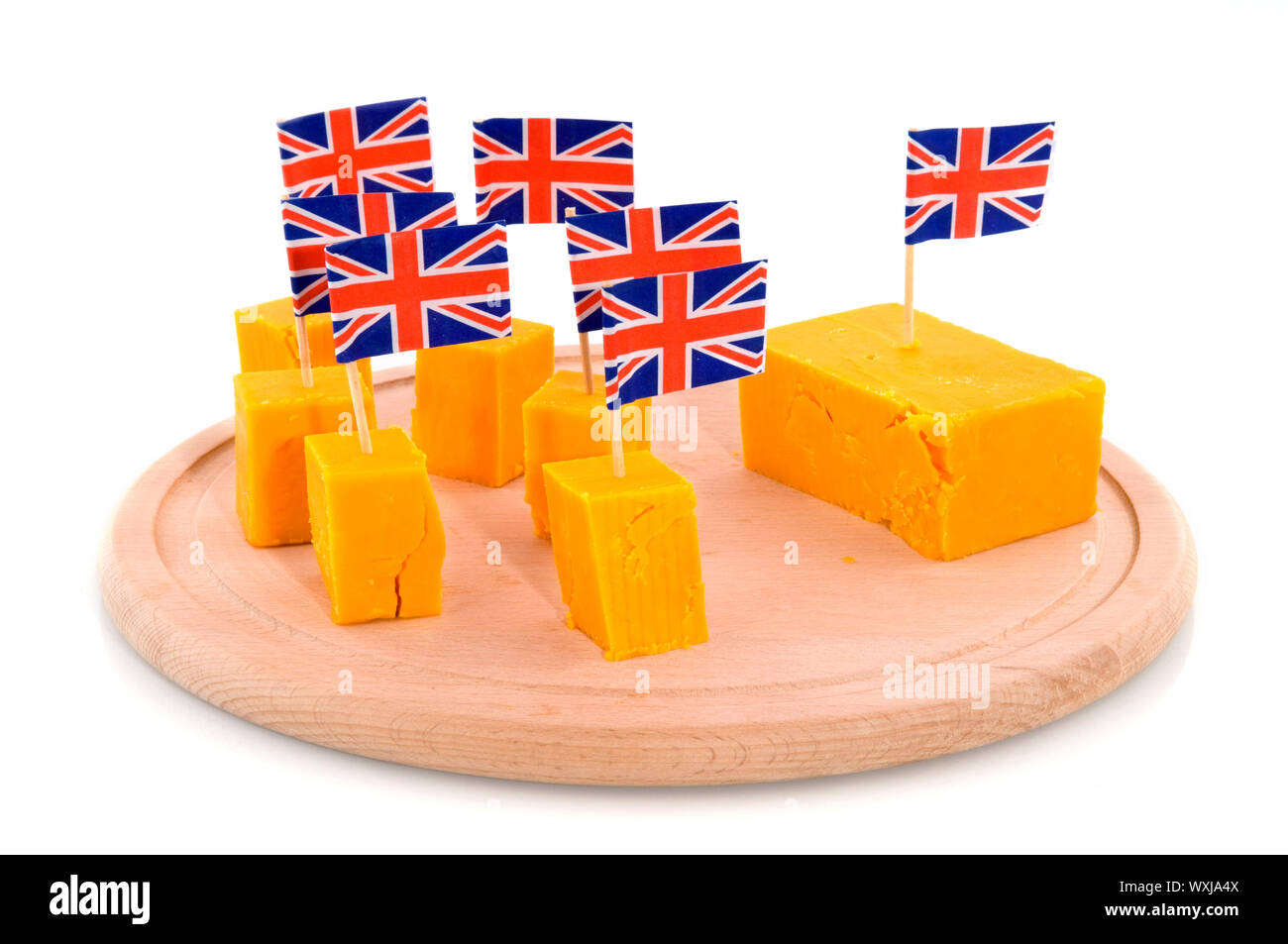 Cubes cheddar cheese from England with flags Stock Photo - Alamy