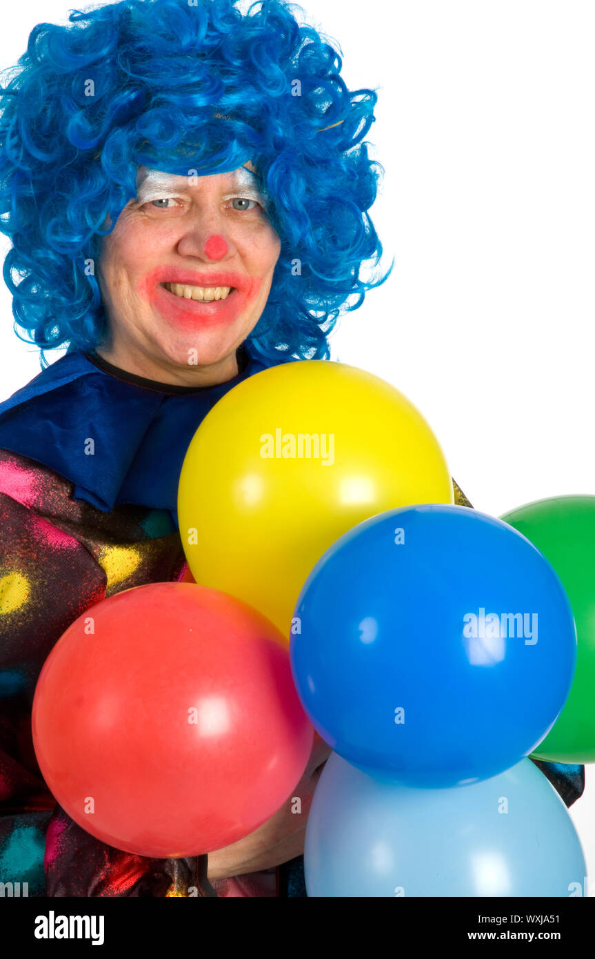 Elderly smiling female clown with colorful balloons Stock Photo - Alamy