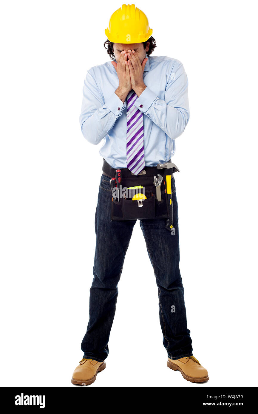 Construction worker hiding his face with hands Stock Photo - Alamy
