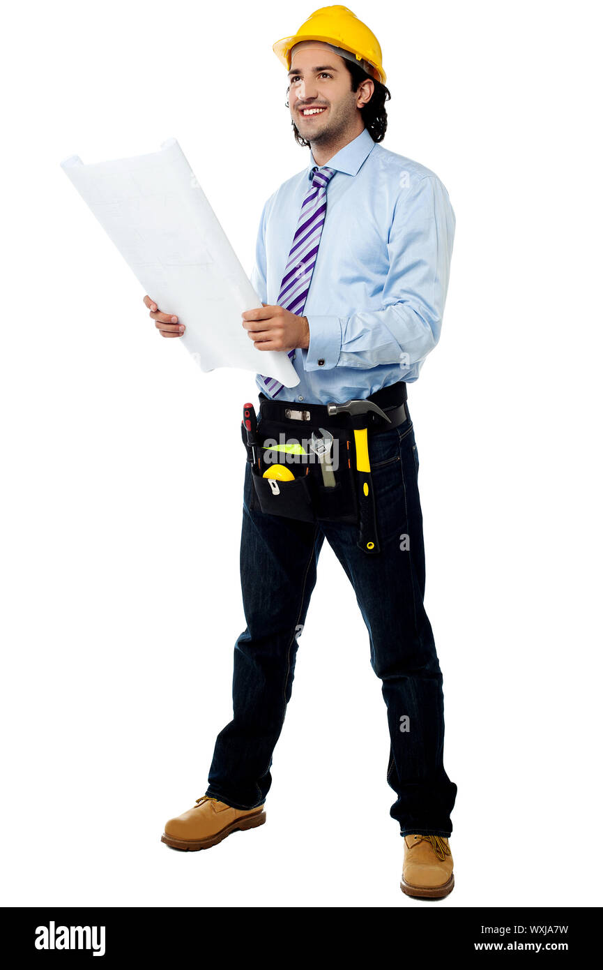 Construction worker with blueprint and tools Stock Photo - Alamy