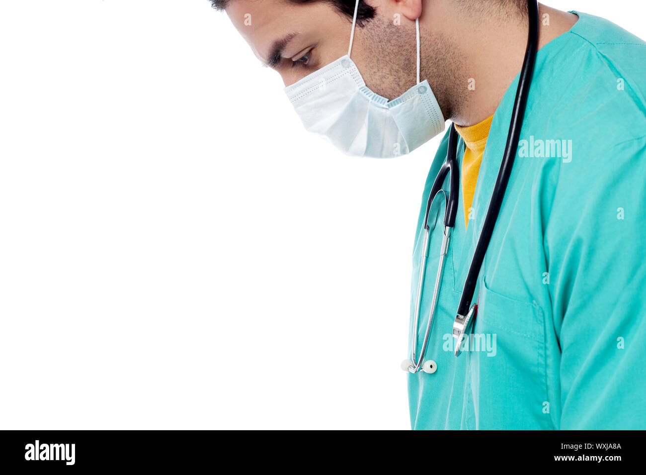 Doctor's face covered with a surgical mask Stock Photo - Alamy