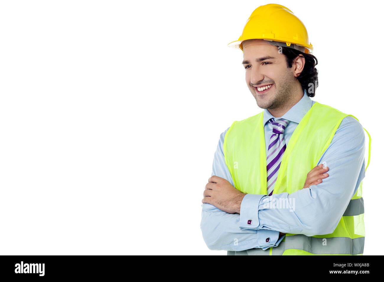 Construction engineer posing with arms crossed Stock Photo - Alamy