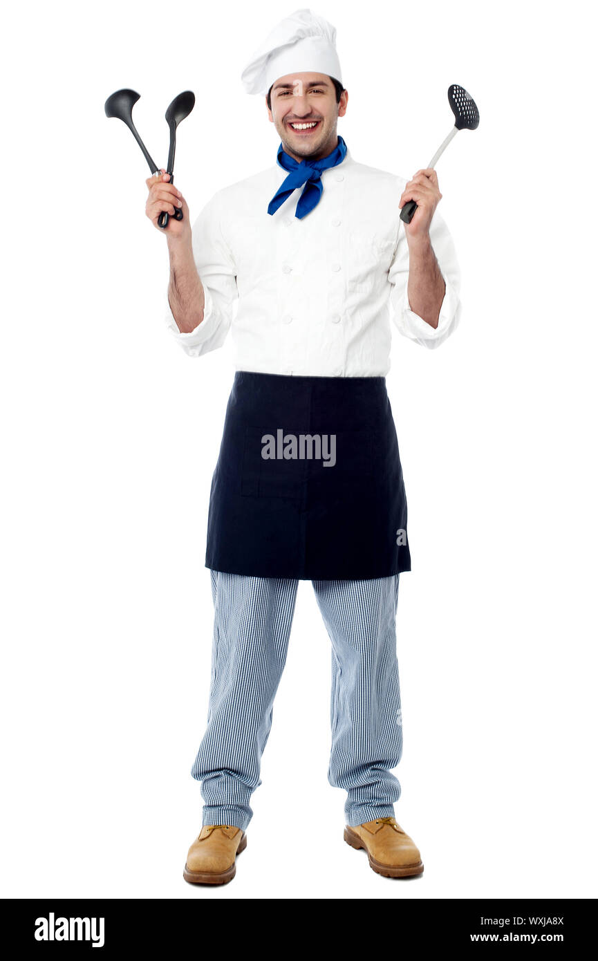 Smart chef displaying kitchen essentials Stock Photo - Alamy