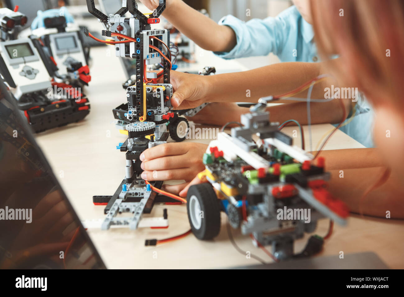 Robotics. Children having class making robots close-up Stock Photo - Alamy