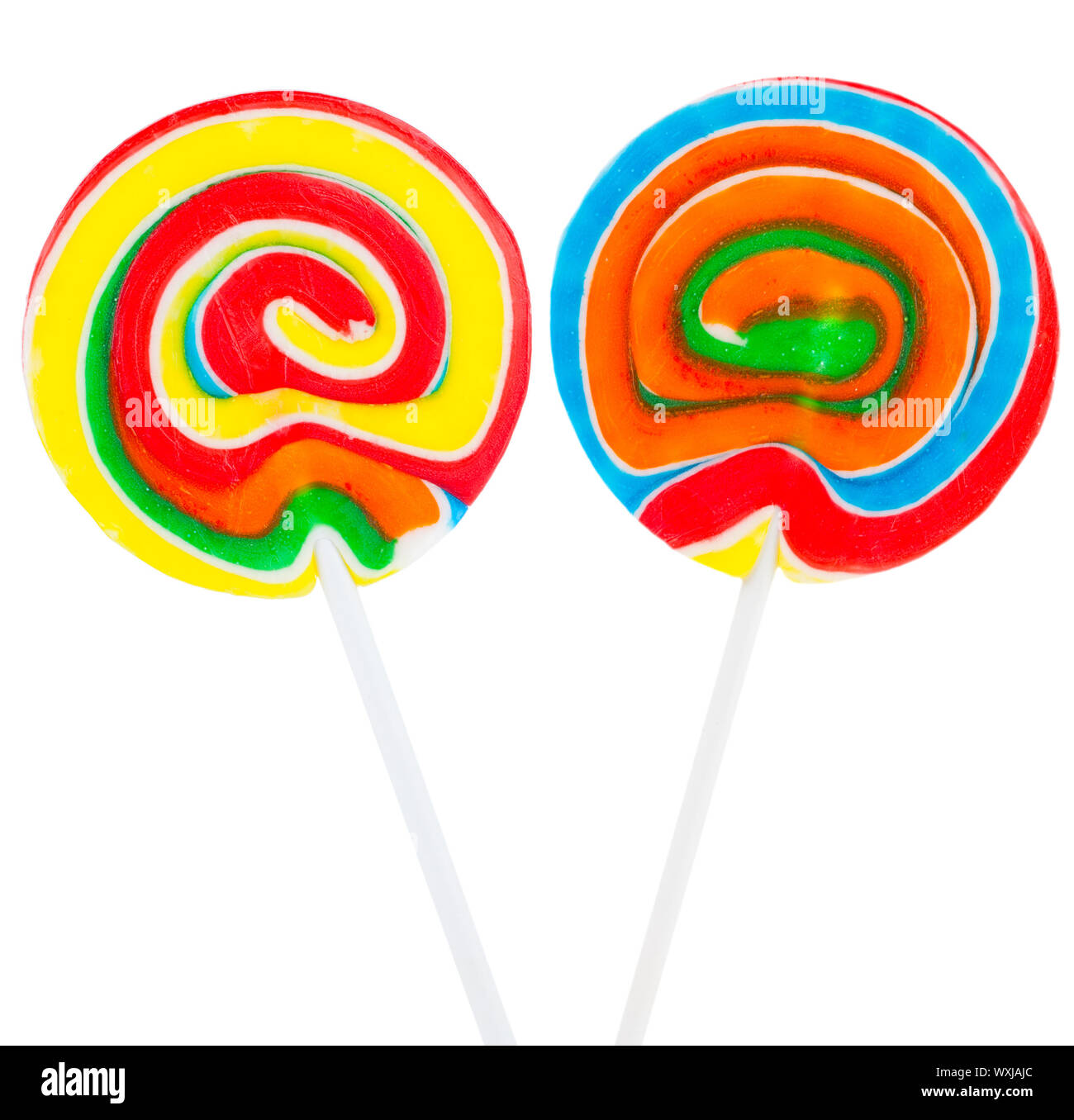 two large lollipop on stick isolated on white Stock Photo - Alamy
