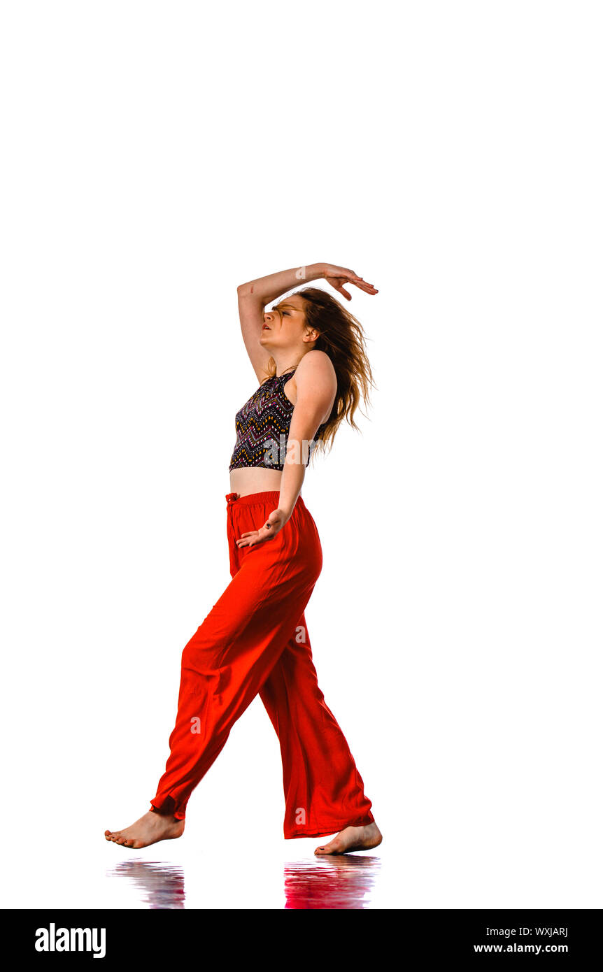 Full body cool looking girl dances modern dance isolated on white ...