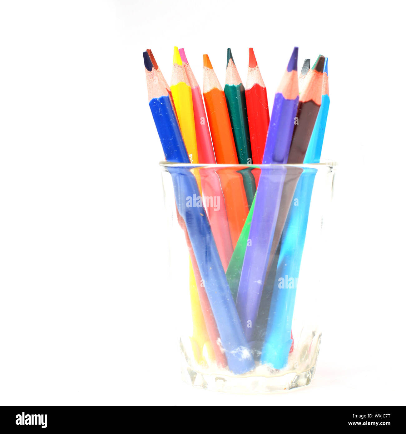 color pencil in glass macro close up on white Stock Photo - Alamy