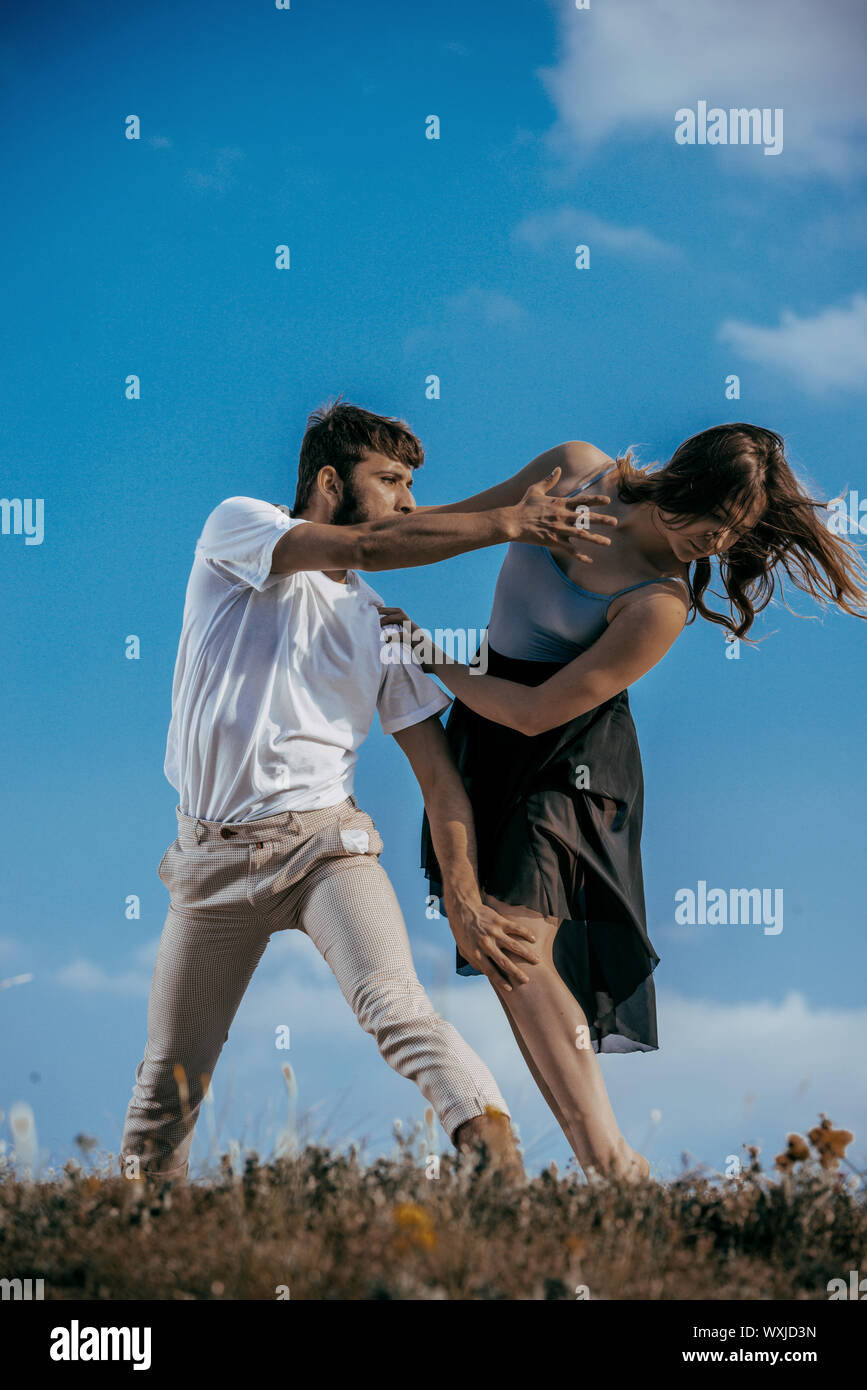 Sensual couple performing an artistical and emotional contemporary ...