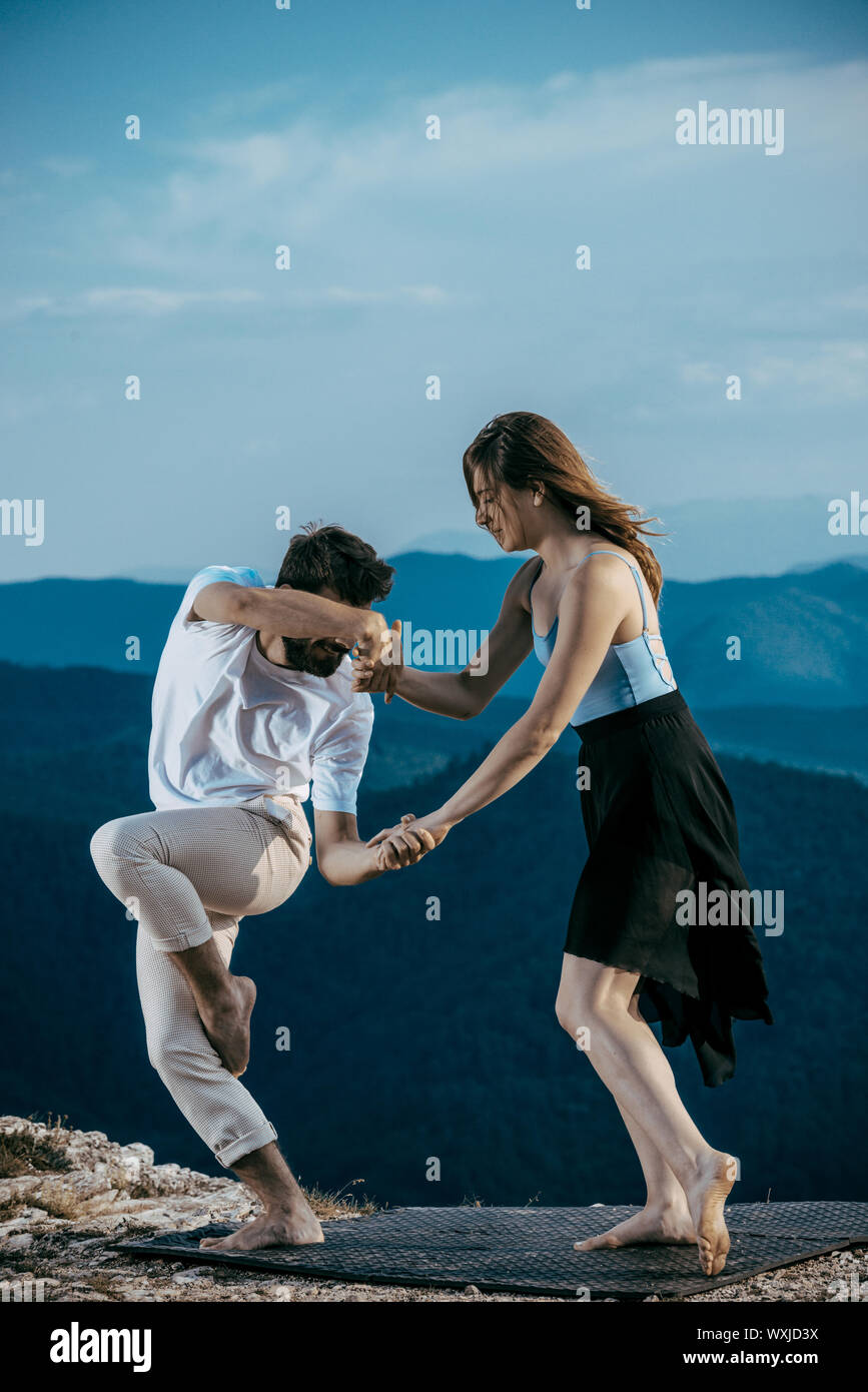 Sensual couple performing an artistical and emotional contemporary ...