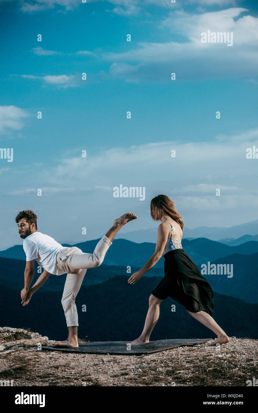 Attractive couple dancing hip-hop. Skillful modern style teenagers ...