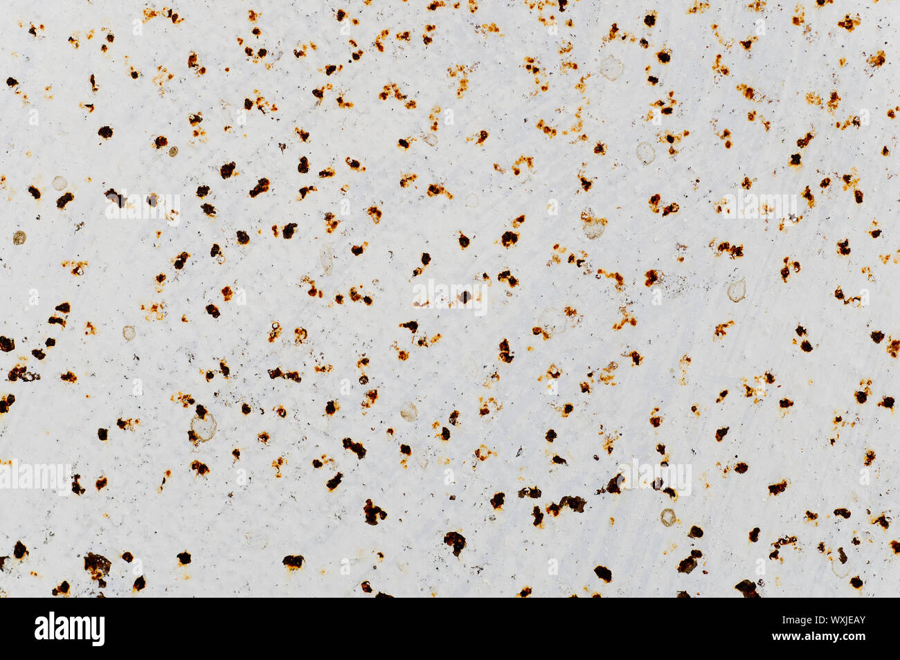 white painted metal surface with rusty spots Stock Photo - Alamy