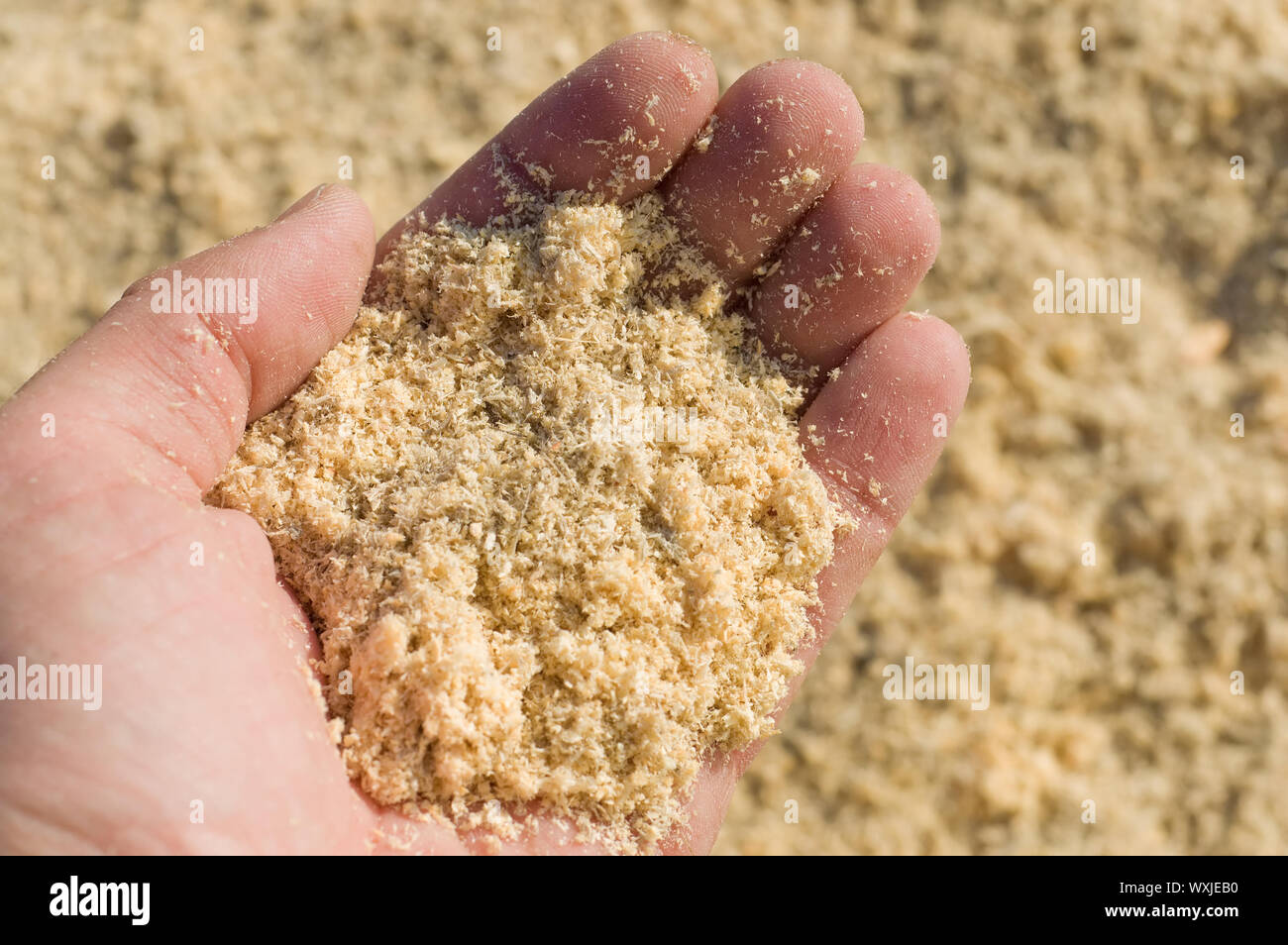 Aggregates with hand hi-res stock photography and images - Alamy