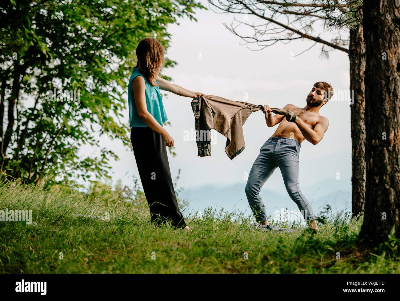 Romantic couple dancing and smiling outside on the meadow Stock Photo ...