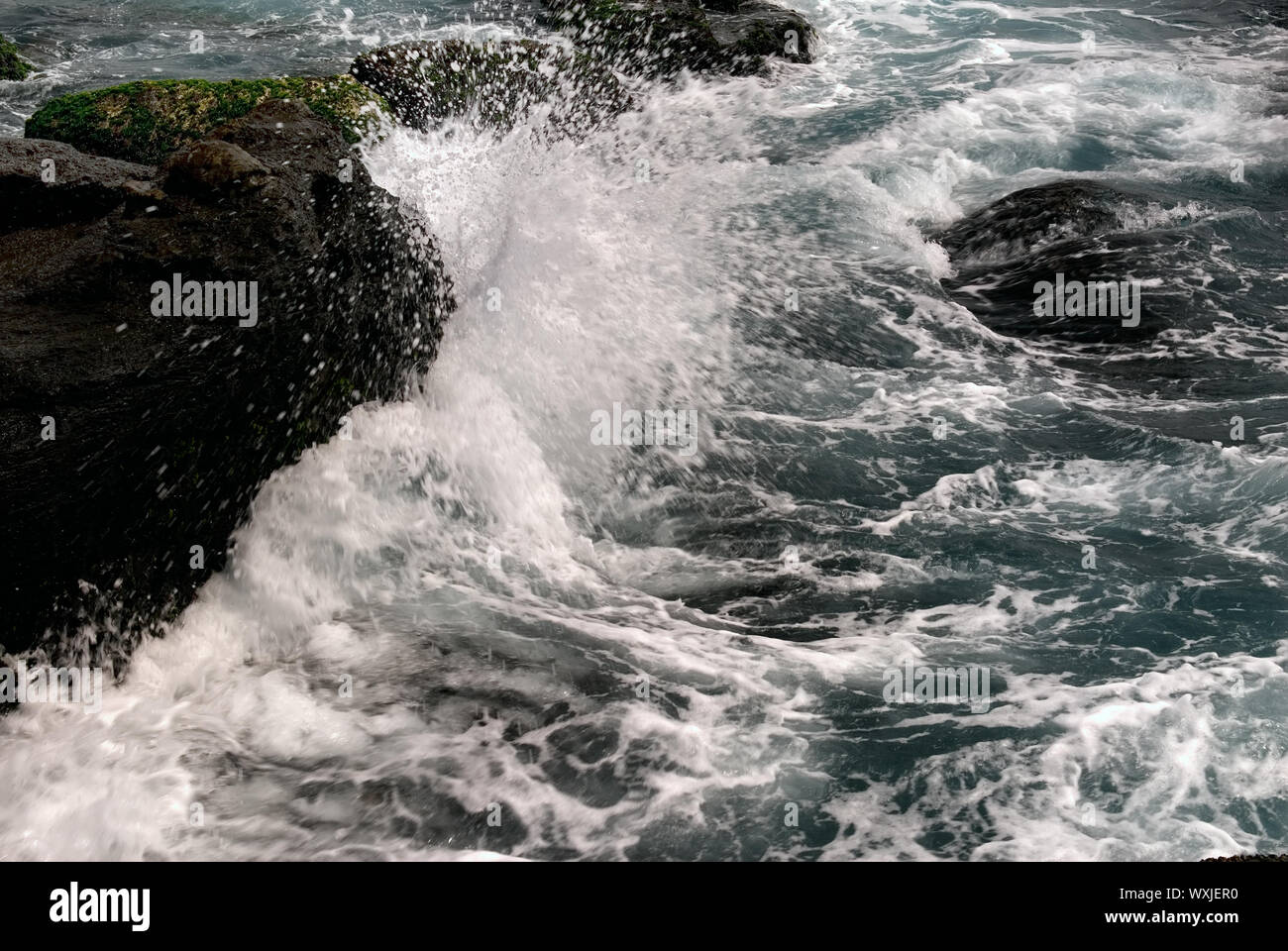 It is powerful waves beating the rock Stock Photo - Alamy