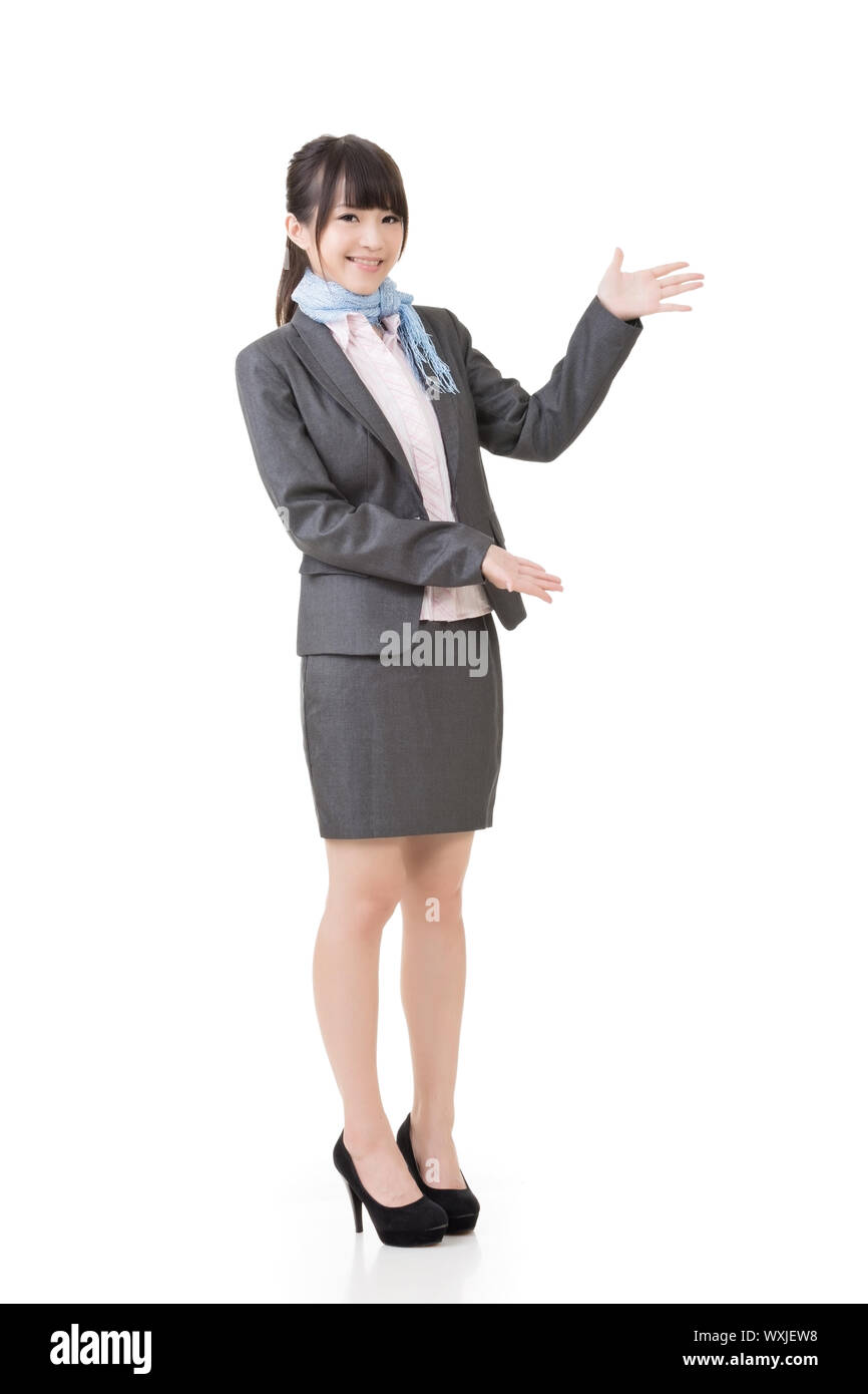 Attractive business woman showing or introducing something with hand on ...