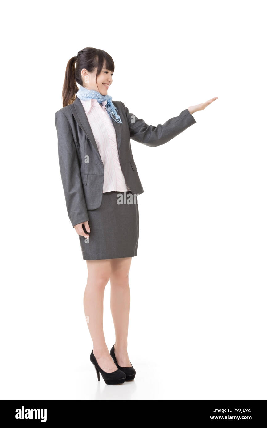 Attractive business woman showing or introducing something with hand on ...