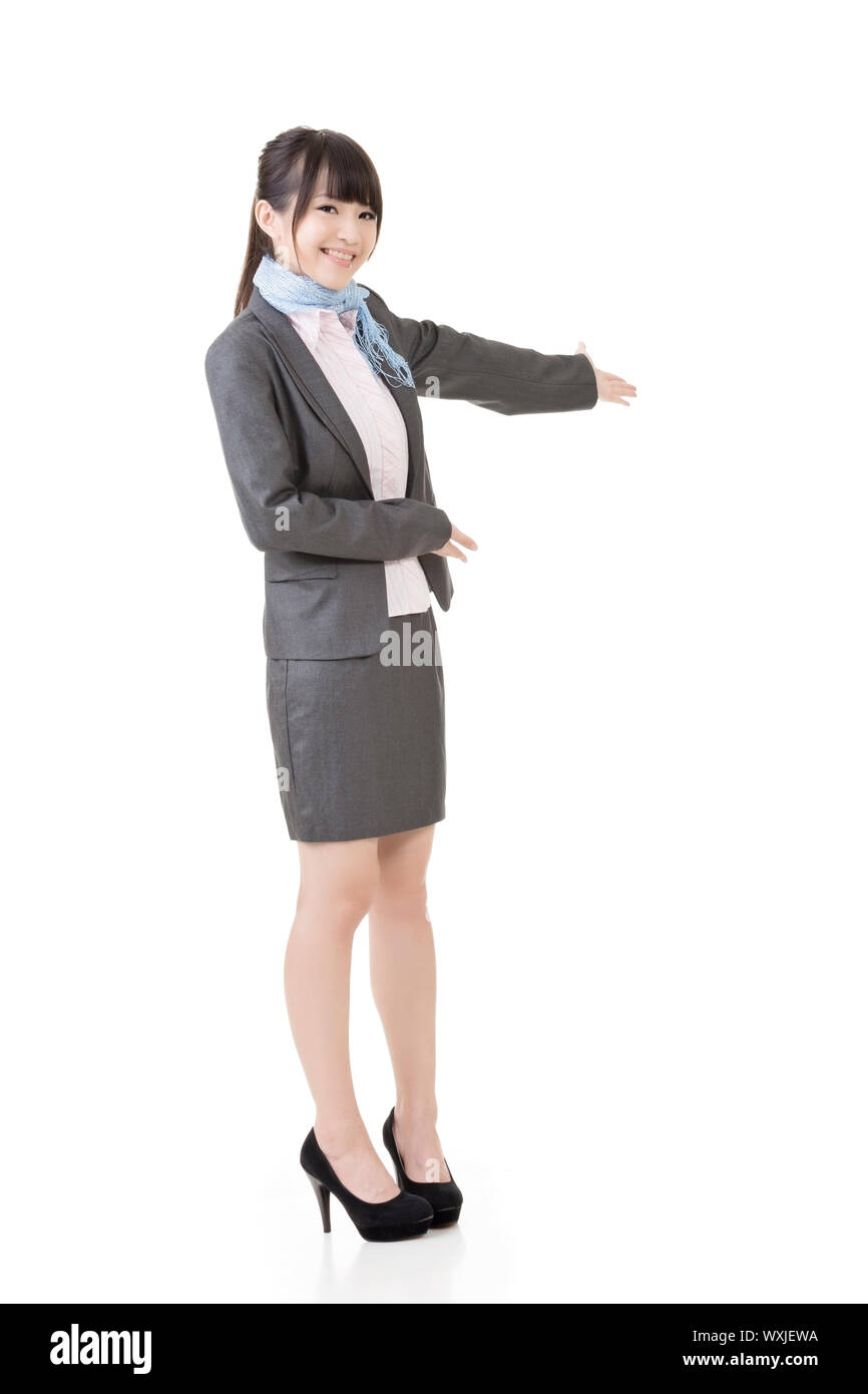 Attractive business woman showing or introducing something with hand on ...