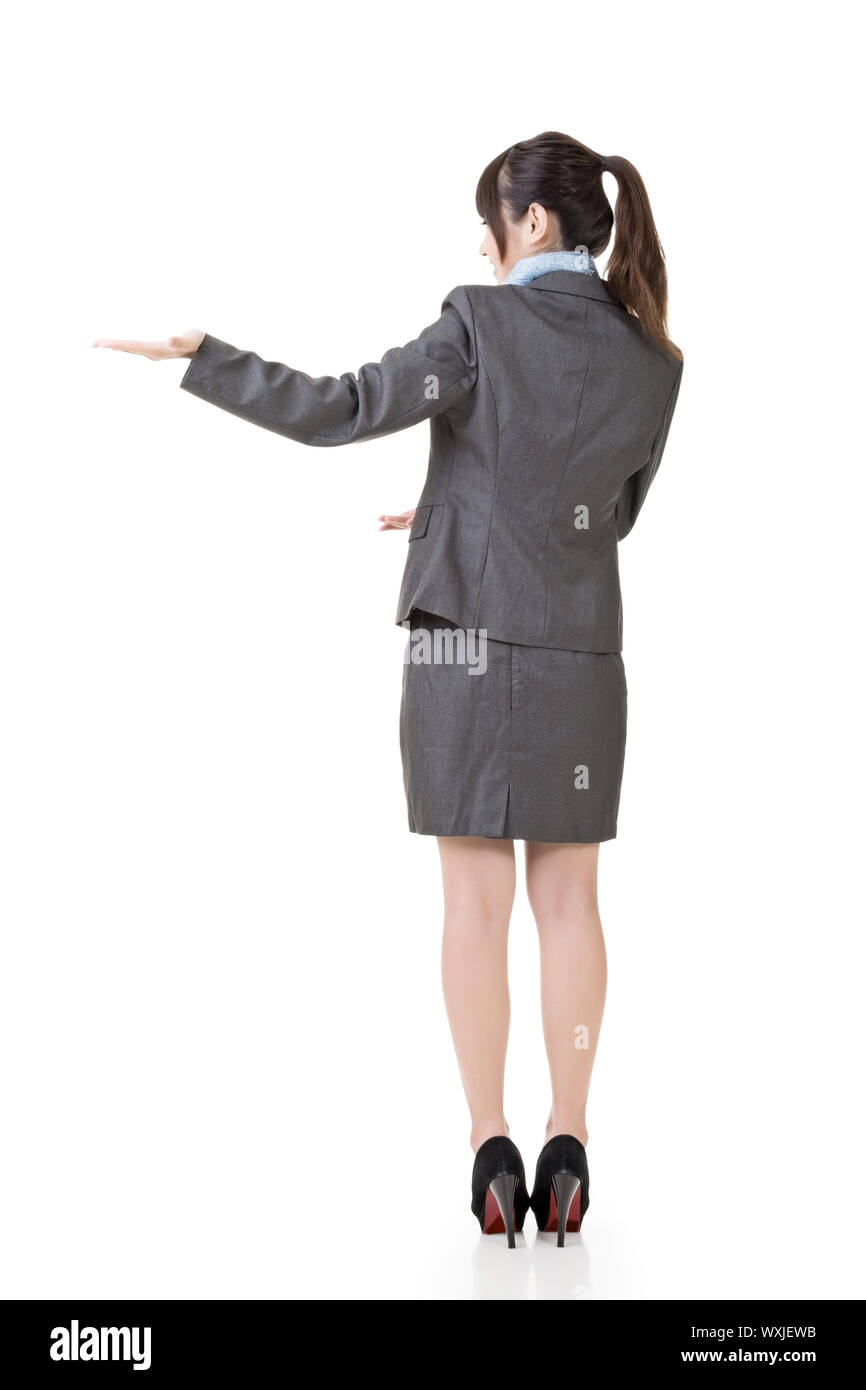 Attractive business woman showing or introducing something with hand on ...