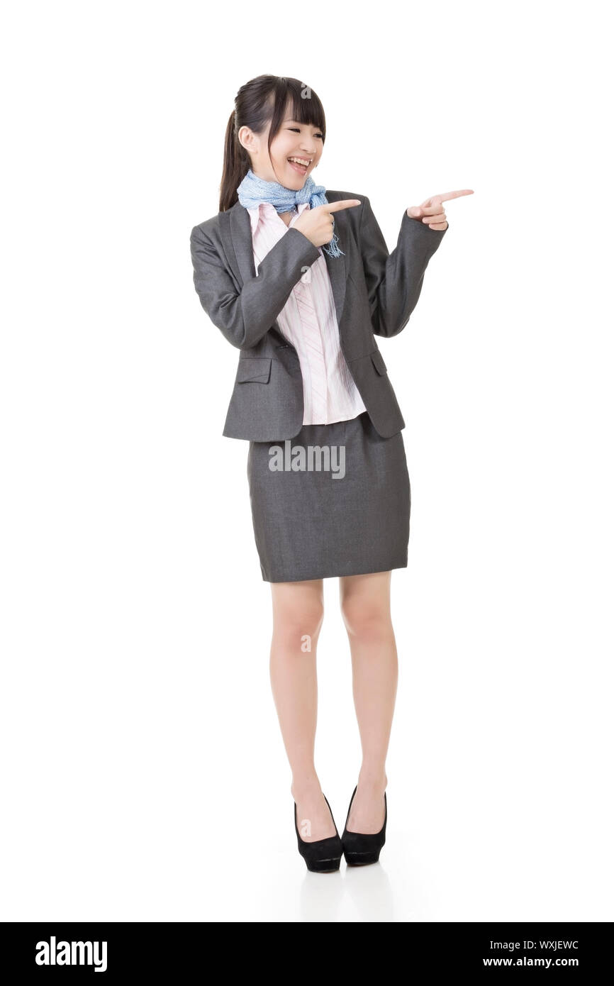 Attractive business woman showing or introducing something with hand on ...