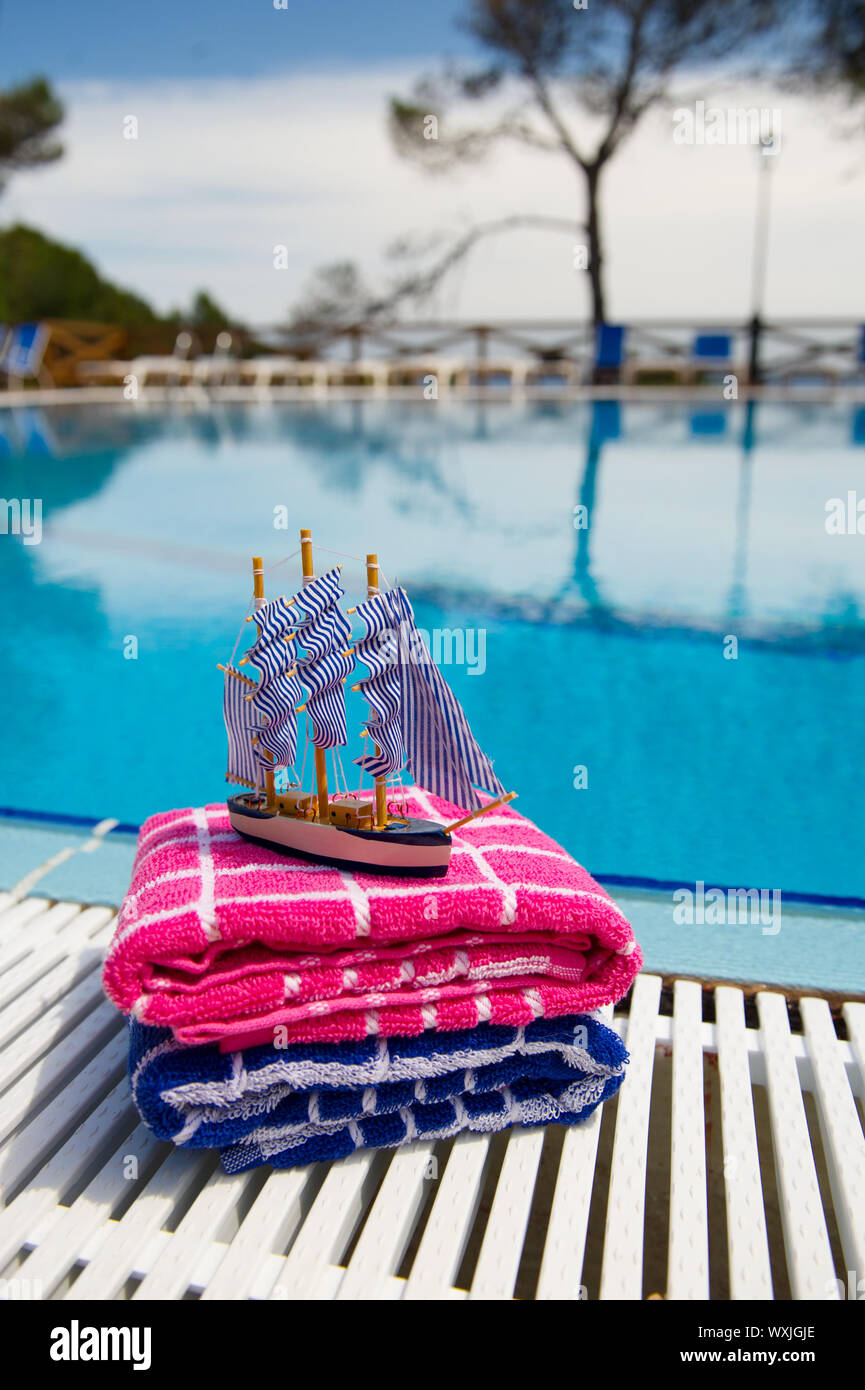 Little sailboat to play with at swimming pool Stock Photo - Alamy