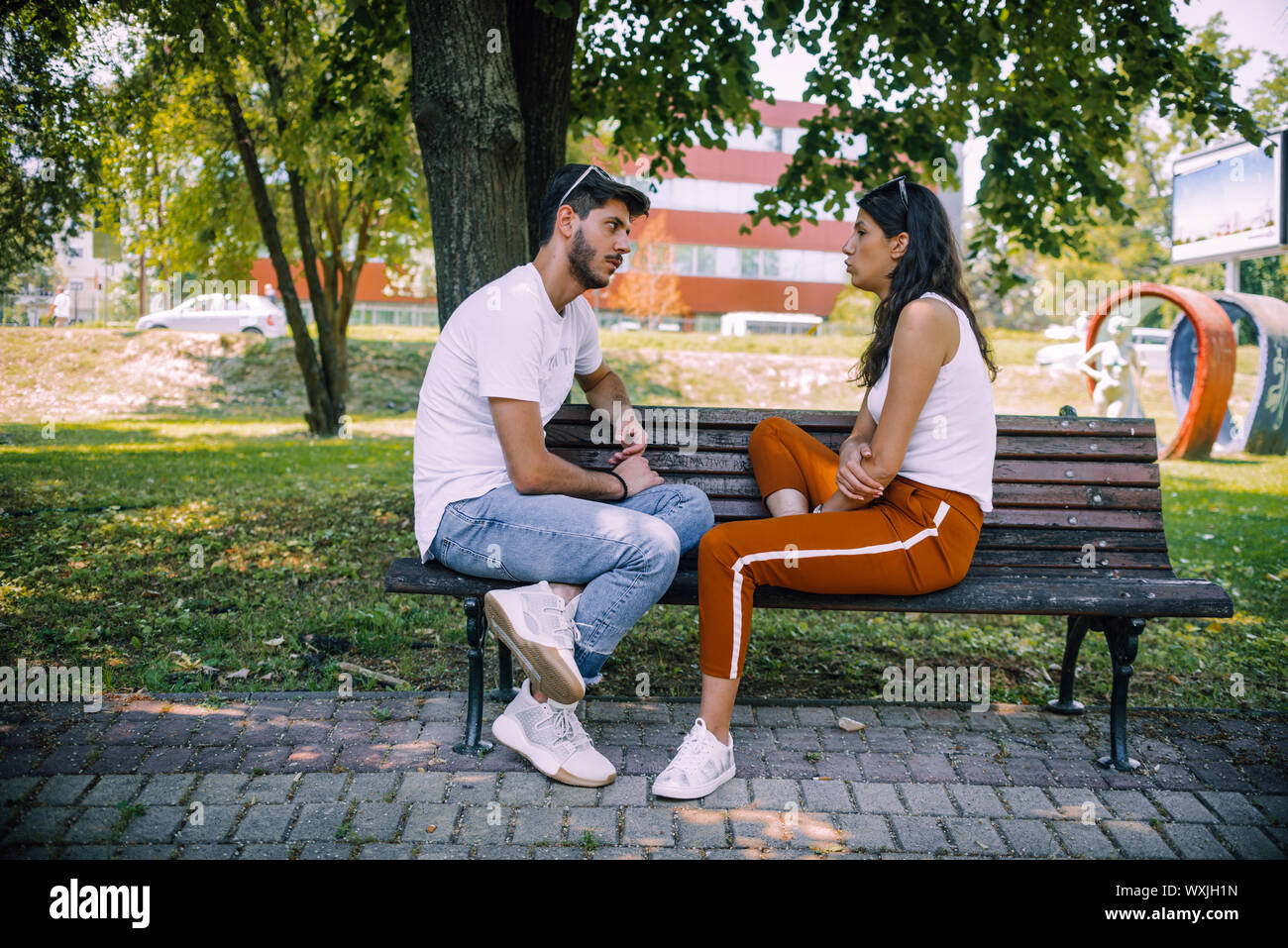 Best friends enjoying time together outdoors on bench. Concept of two ...