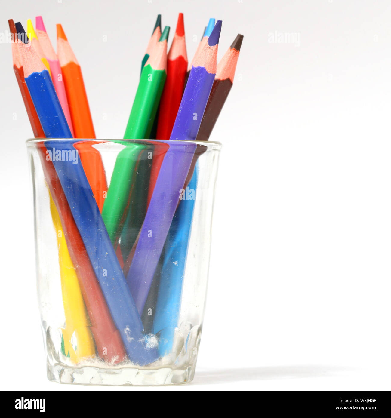 color pencil in glass macro close up on white Stock Photo - Alamy