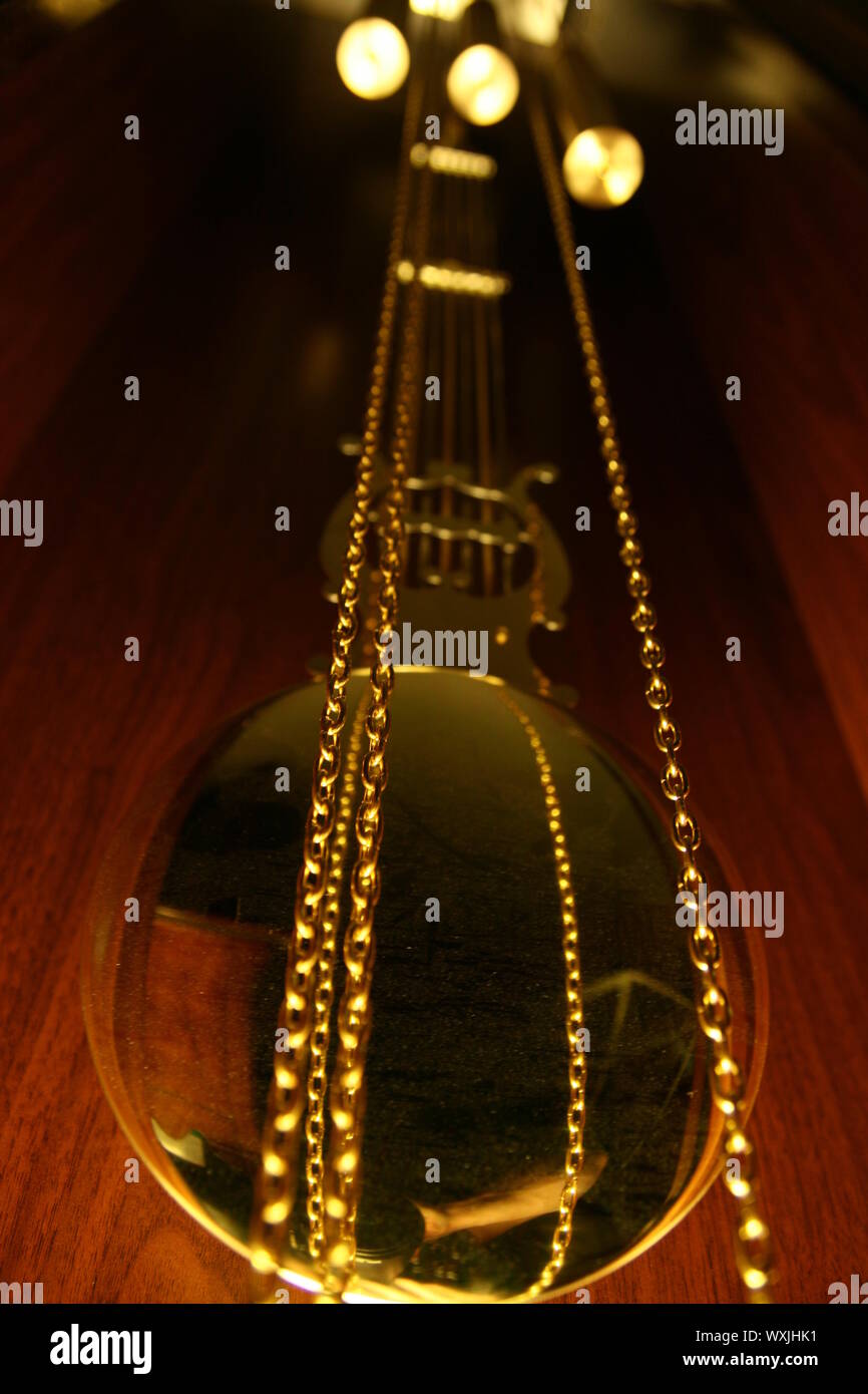 ancient golden wall clock closeup Stock Photo - Alamy