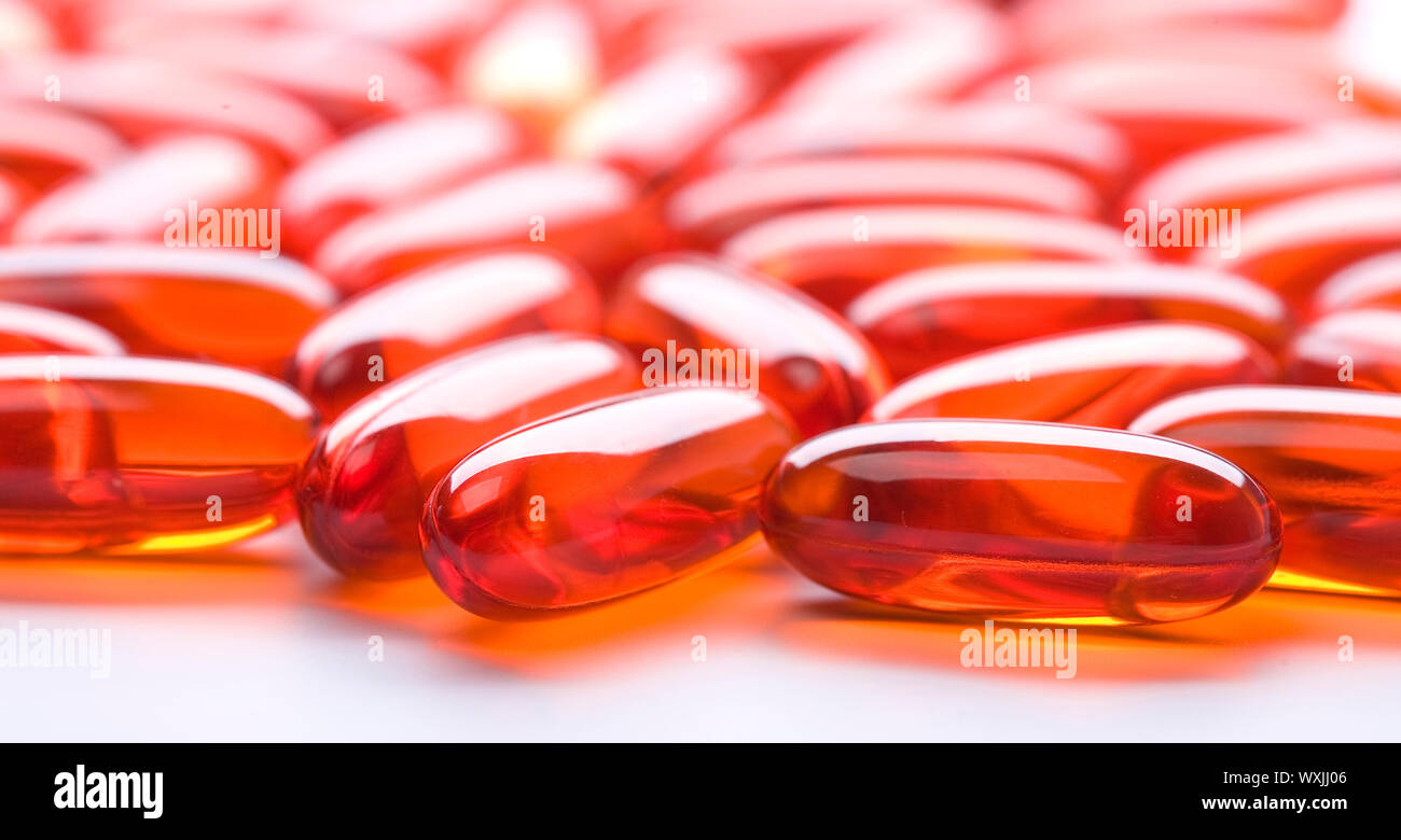 red tablets on white background Stock Photo - Alamy