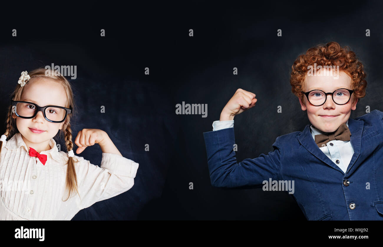 Successful little kids student having fun against chalkboard background ...