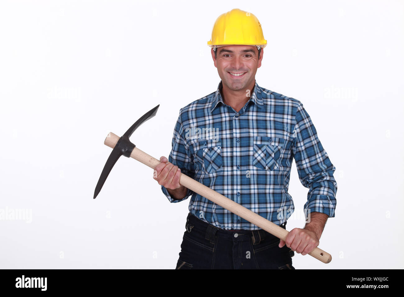 craftsman holding a pick Stock Photo - Alamy